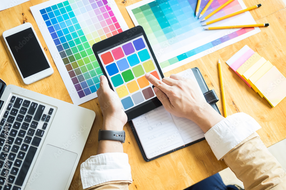 Creative Graphic designer at work. Color swatch samples pantone palette ...