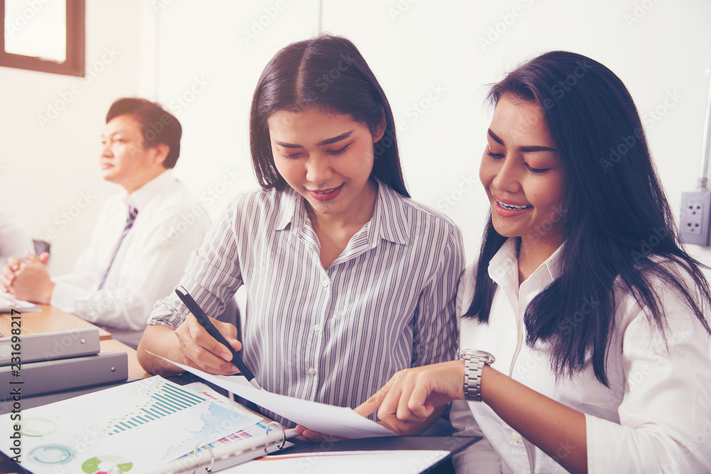 In the office, female managers are introducing and coaching new ...