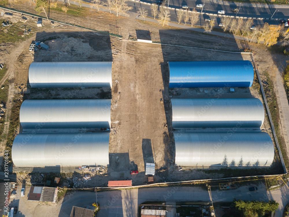 Aerial view of the six round storage rooms of the hangars on a bright ...