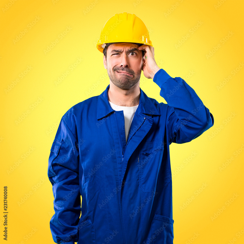 Young workman with helmet with an expression of frustration and not ...