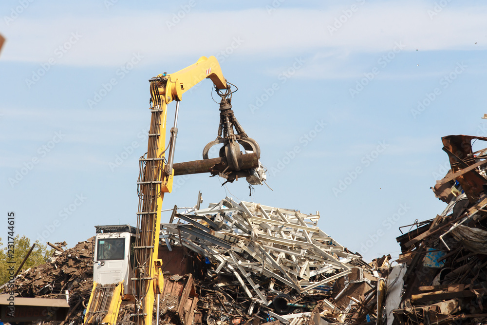 Junkyard crane with maginet moving scrap recycled steel Stock Photo ...