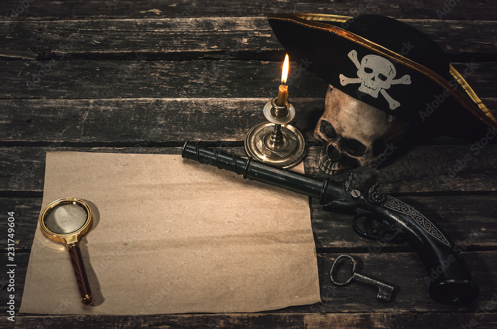 Pirate treasure map with copy space, pirate captain hat, human skull ...