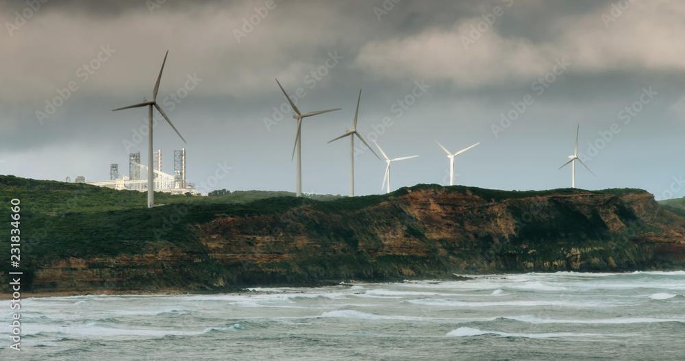 Wind towers at in Southern Australia with moody sky and aluminium ...