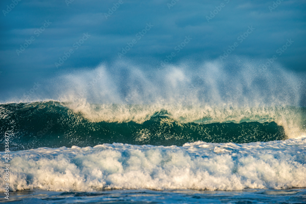 Powerful ocean wave on the surface of the ocean. Wave breaks on a ...