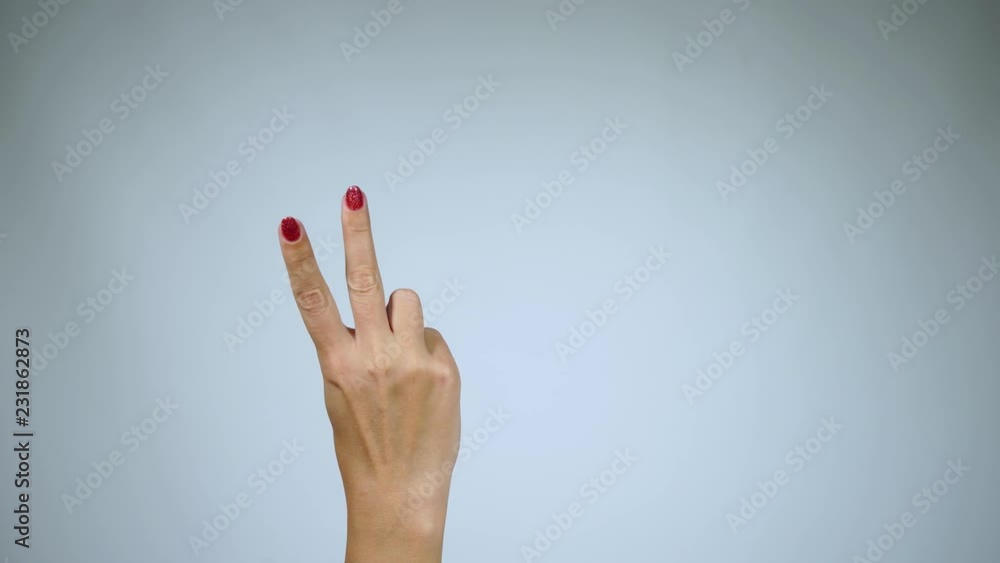 Vidéo Stock Woman raising two fingers up and showing peace or victory ...