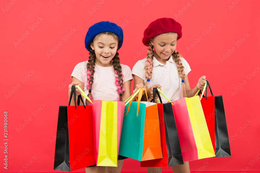 Children satisfied by shopping red background. Obsessed with shopping ...