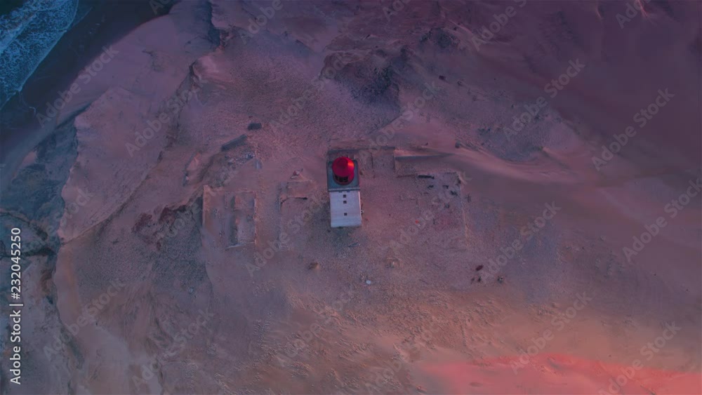 Cinematic aerial from plan view to level of Rubjerg Knude lighthouse ...