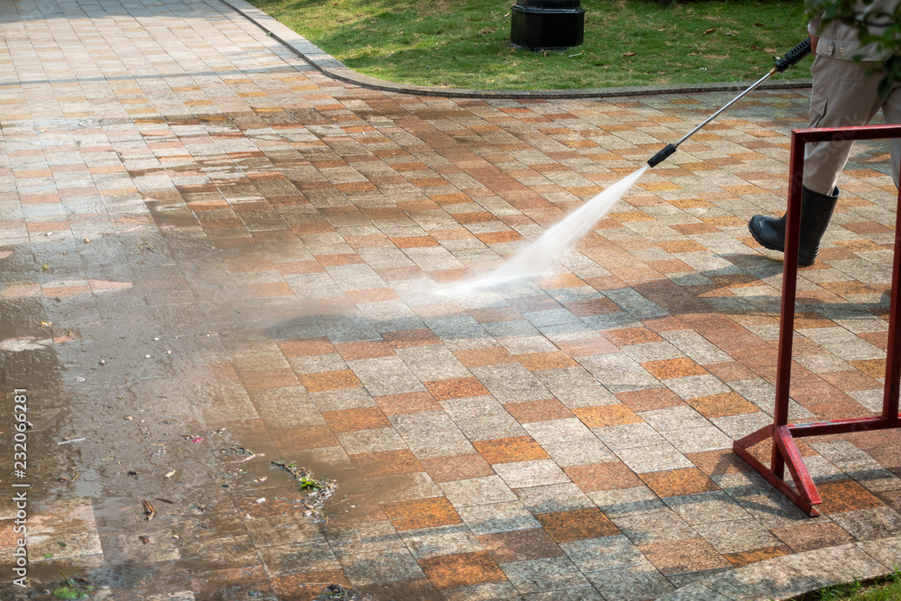 Outdoor floor cleaning with a pressure water jet on street Stock Photo ...