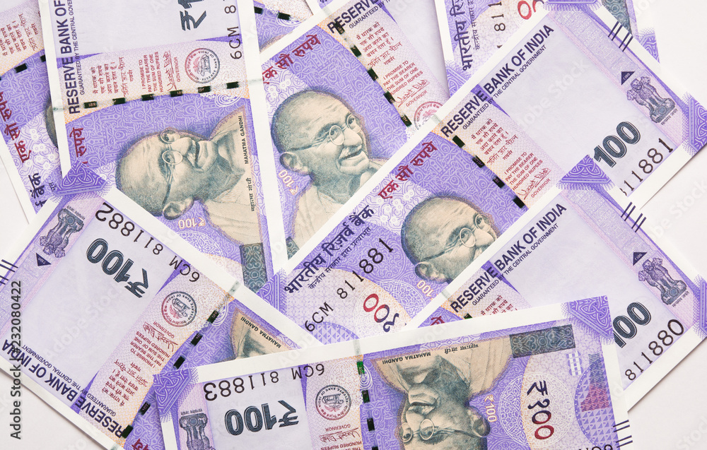 All new 100 Rupees Indian Currencies Scattered on islolated background ...
