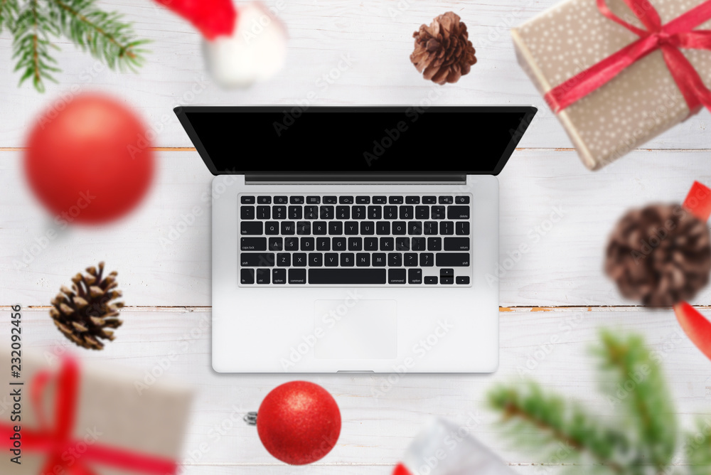 Christmas gifts and decorations come out of the laptop. An empty screen ...