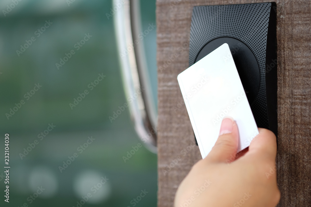 Door access control with a hand inserting keycard to unlock door ...