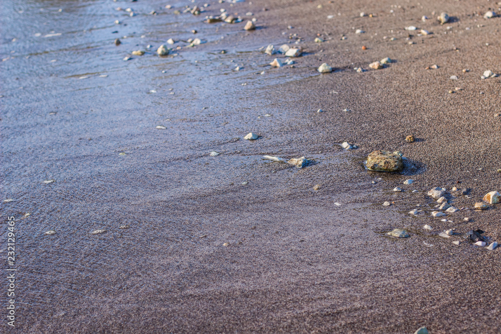 soft focus sea sand and stones shore line waterfront background texture ...