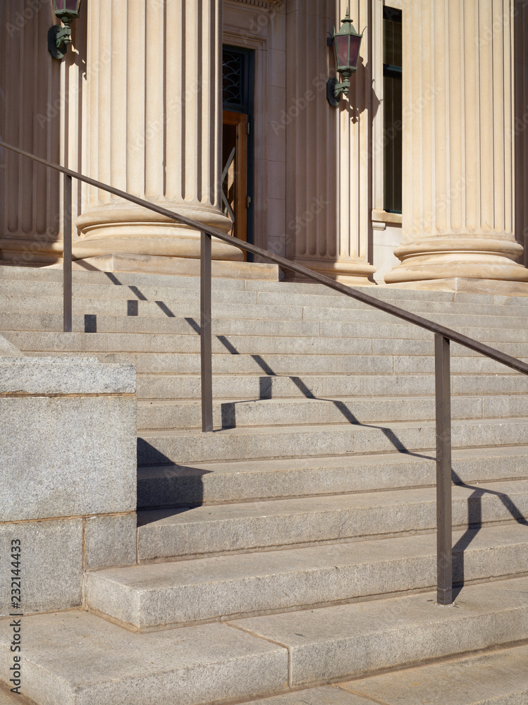 Staircase and railing leading up to a courthouse Stock Photo | Adobe Stock