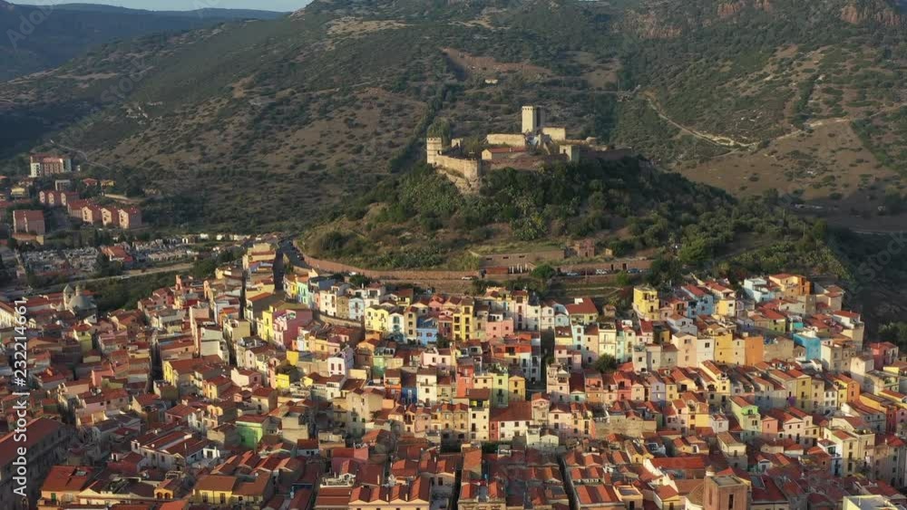 Aerial view of the beautiful village of Bosa with colored houses and a ...
