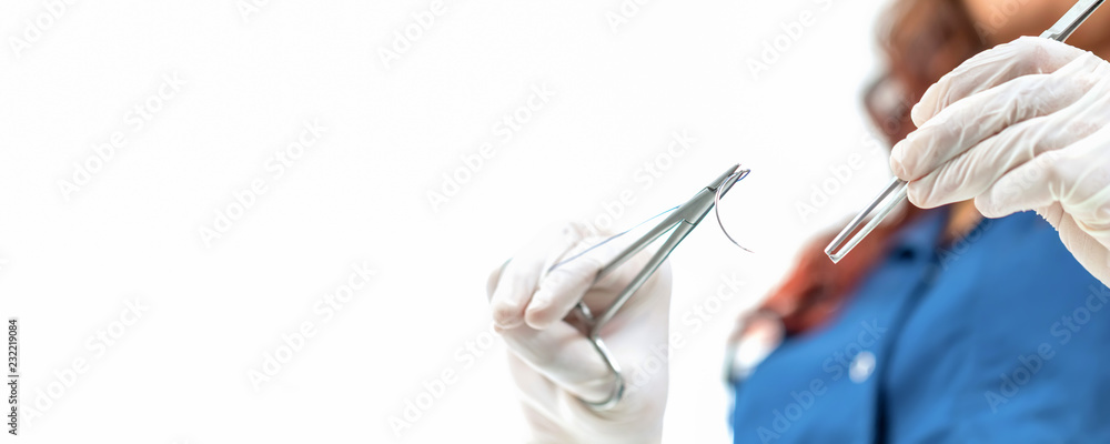 Doctor holding surgical forceps suture needle, suturing material Stock ...