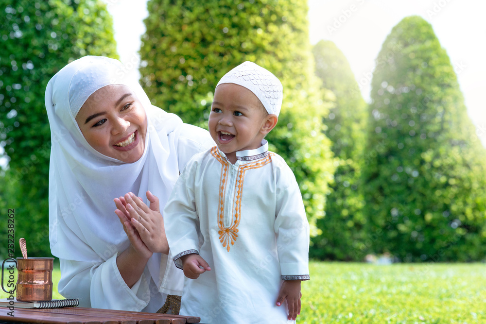 Asian Muslim mother and her son enjoying quality time at park, Muslim ...
