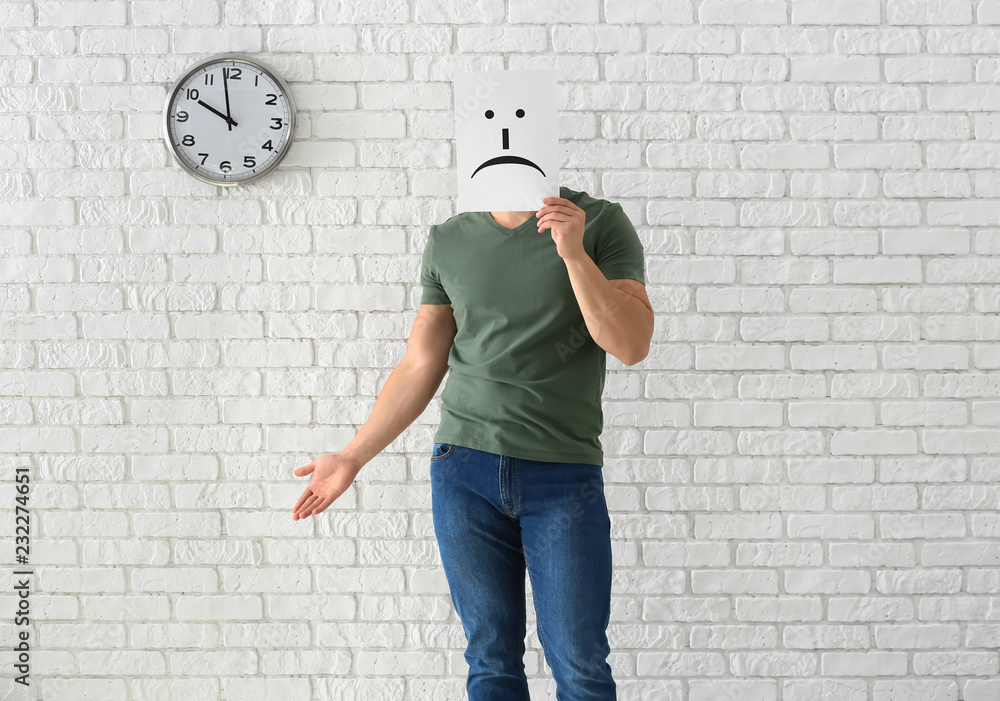 Man Hiding Behind Wall