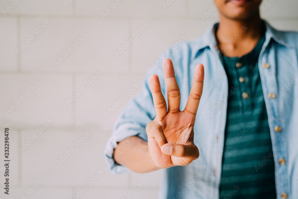 showing three fingers Stock Photo | Adobe Stock