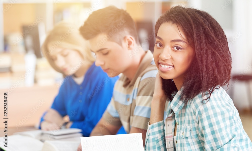 Young students studying on background Stock Photo | Adobe Stock