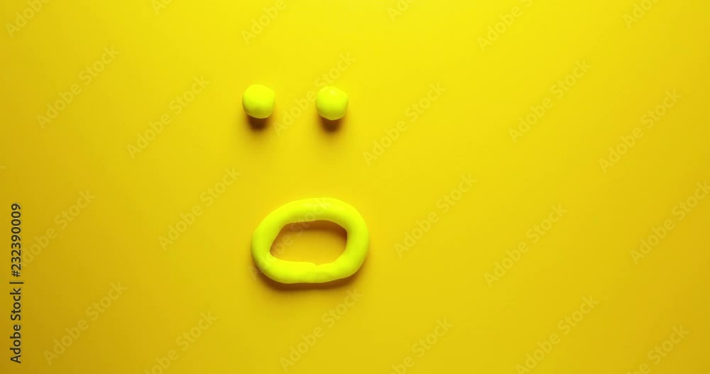 4K stop motion animation of a smiley face made out of modelling clay ...