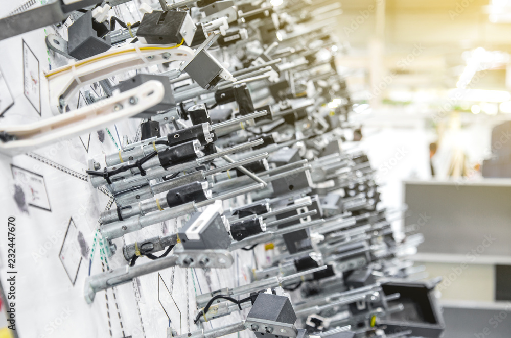 Metal rods on an inclined stand for the production of sets of ...