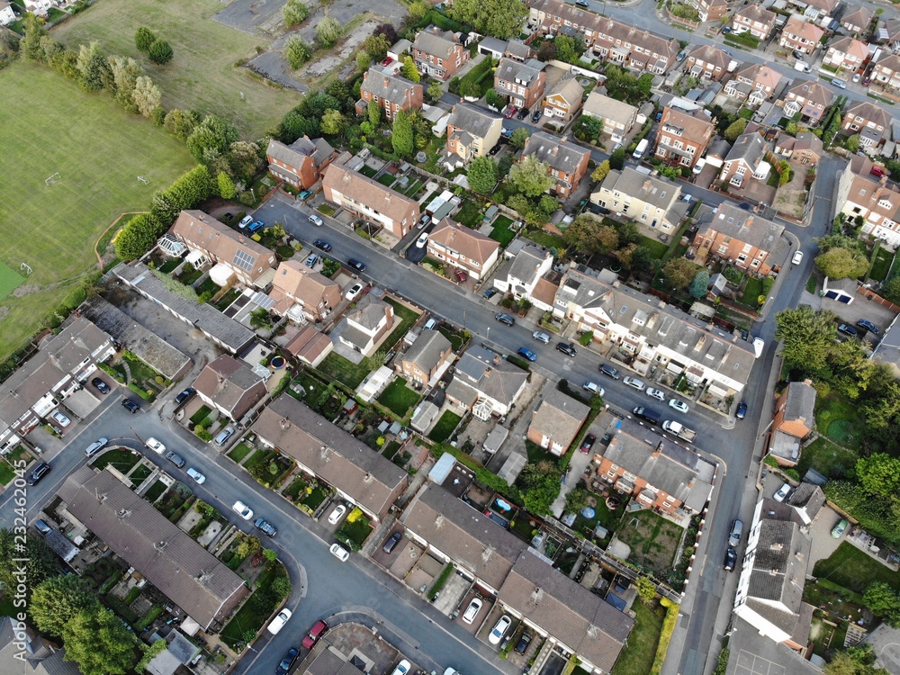 Typical UK Town aerial photo showing rows of houses, roads, parks and ...