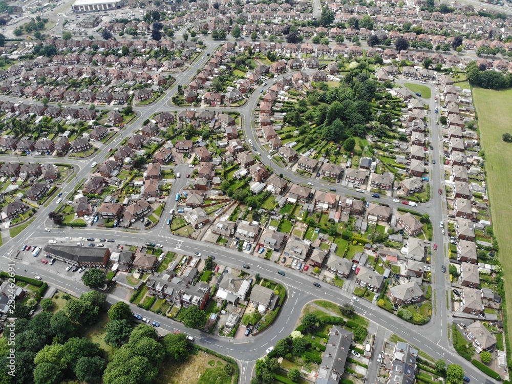 Typical UK Town aerial photo showing rows of houses, roads, parks and ...