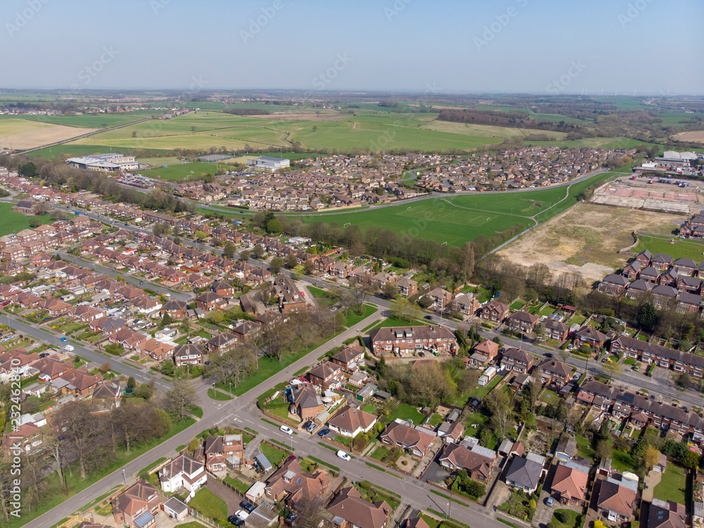 Typical UK Town aerial photo showing rows of houses, roads, parks and ...