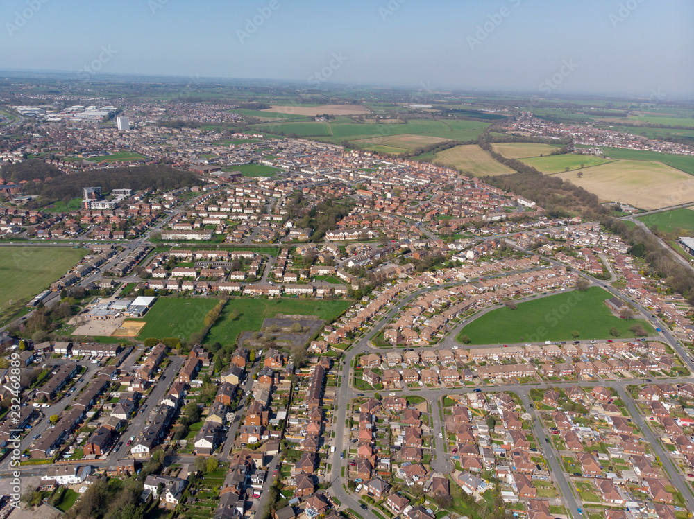 Typical UK Town aerial photo showing rows of houses, roads, parks and ...