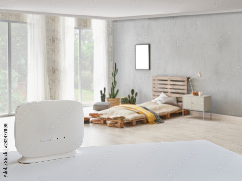 Router and Modem internet box close up and on the white table. Modern ...