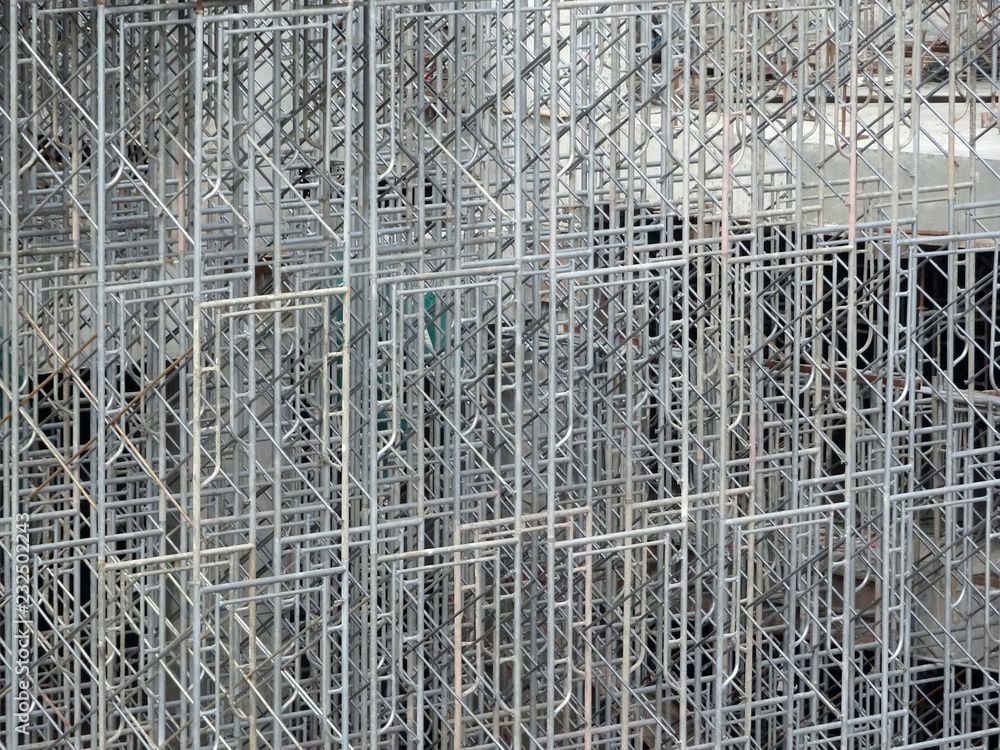 Metal scaffolding installed by construction workers at the construction ...