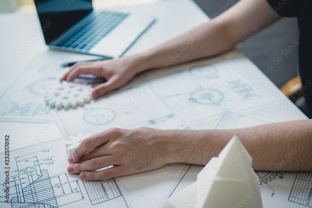 Engineering man's hand working with 3D printer's components and ...