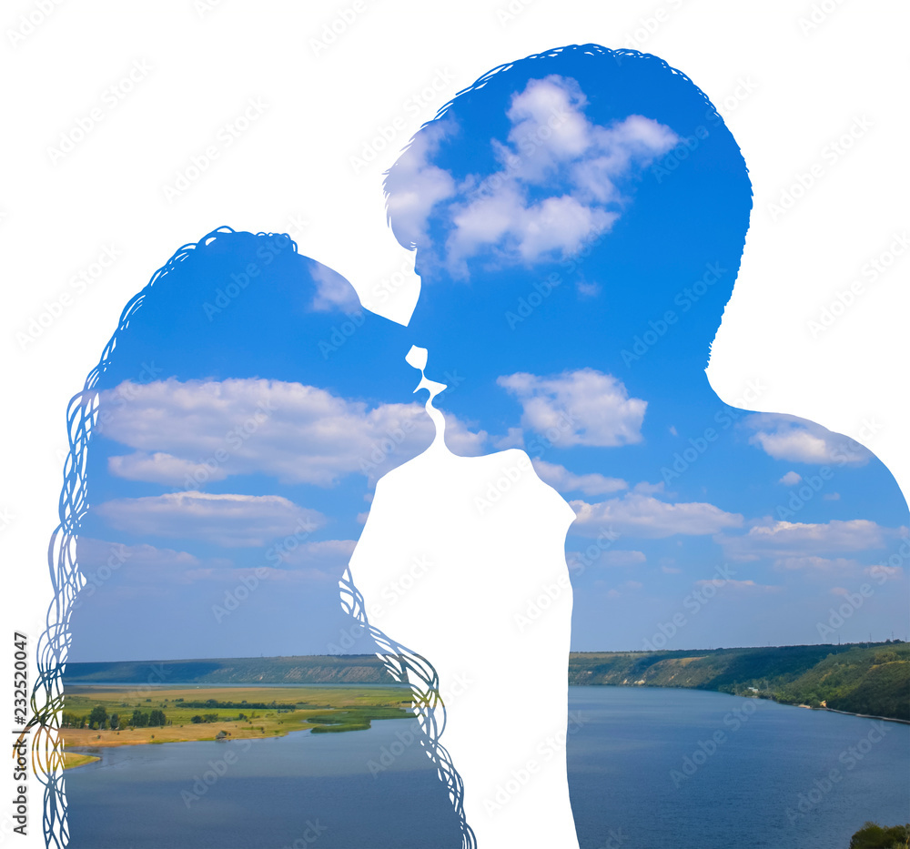 Double exposure - the silhouettes of the girl and the guy who kiss ...