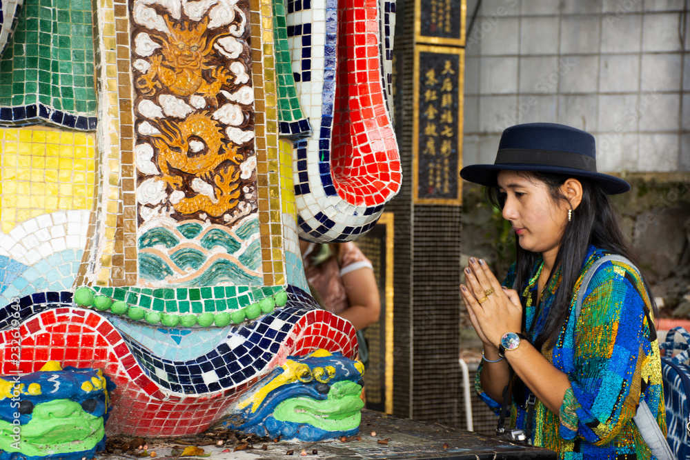 Foto de Traveler thai woman visit and respect praying Dragon god of the ...