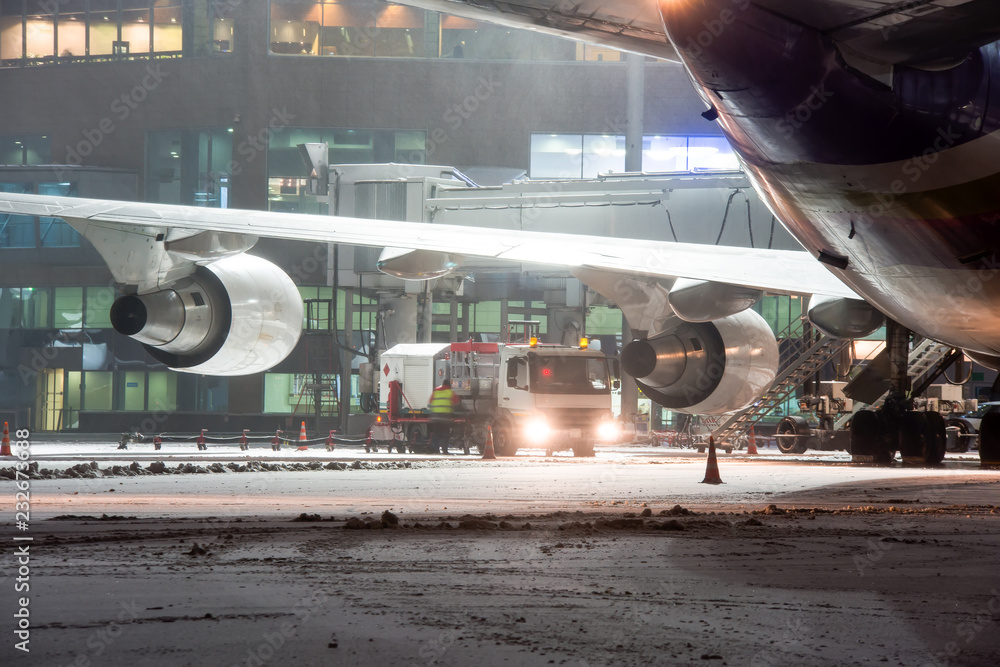 Ground handling passenger airplane at night winter airport Stock Photo ...