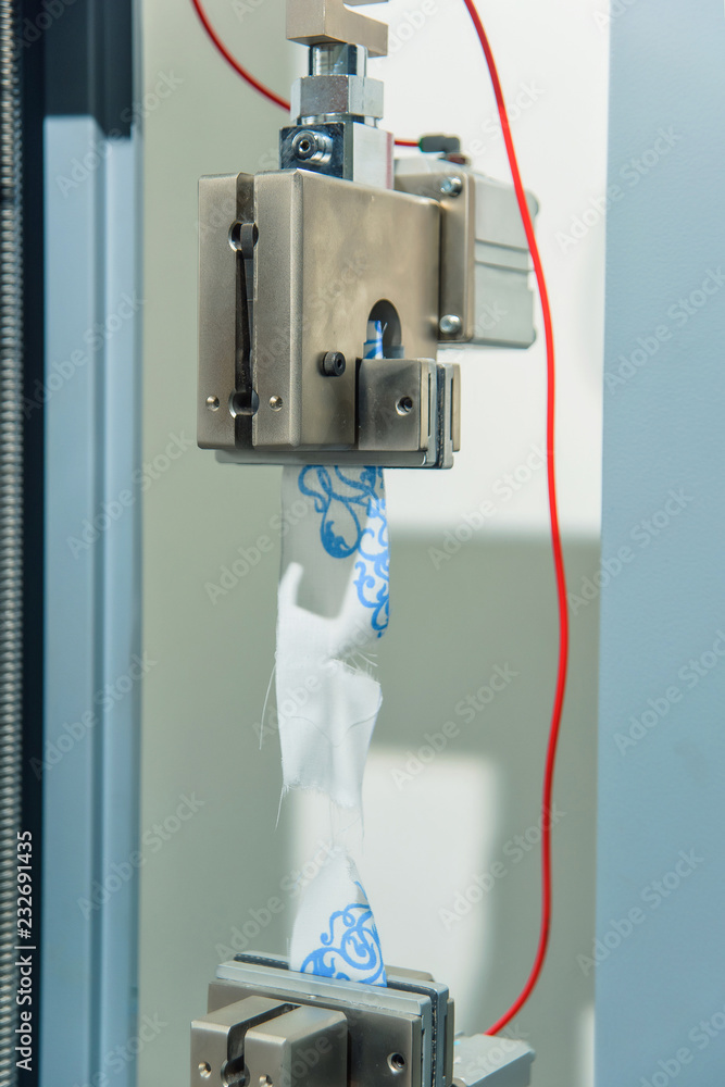 Testing the fabric for strength. Textile industry. Fabrication at the ...