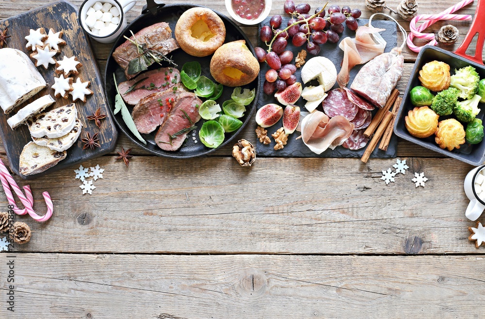 Christmas dinner table with roast beef,yorkshire pudding,appetizers ...
