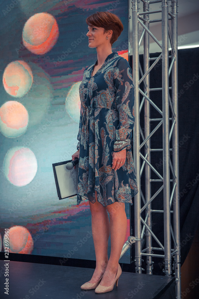 Moderator of fashion shows at the business center Stock Photo | Adobe Stock