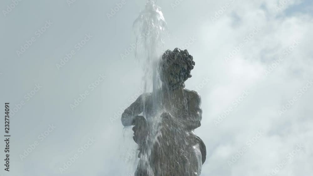 fountain flow is pouring from statue of human, ancient architectural ...