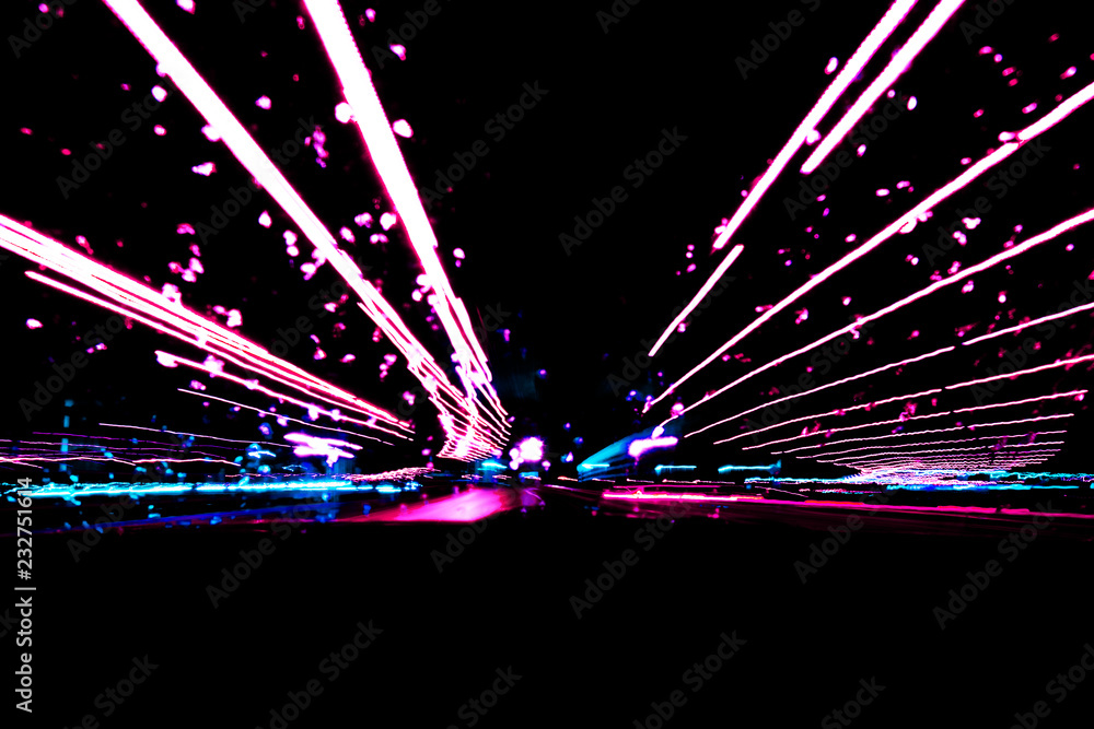 Blurred background with Cars light trails on a curved highway at night. Night traffic trails ...