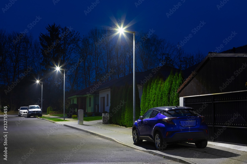 small city street with modern LED streetlights at night Stock Photo ...
