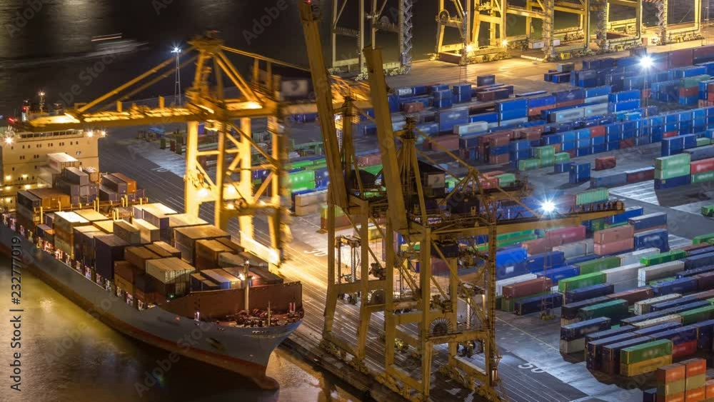 Seaport and loading docks at the port with cranes and multi-colored ...