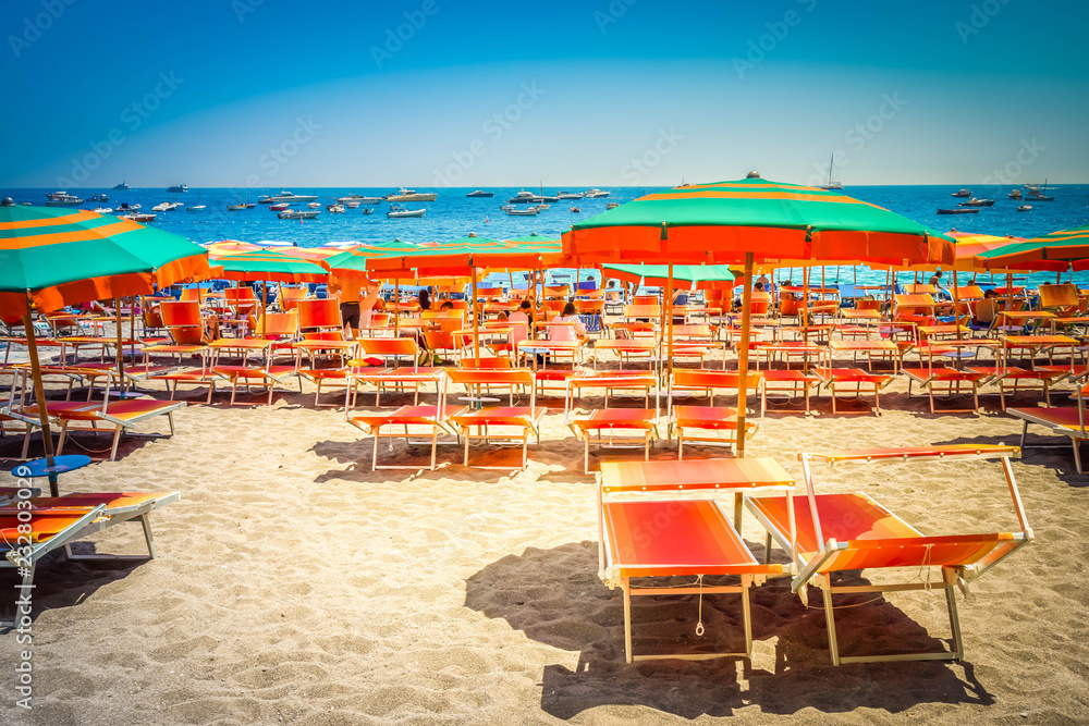 umrellas and chairs on the beach of Positano - famous old italian ...