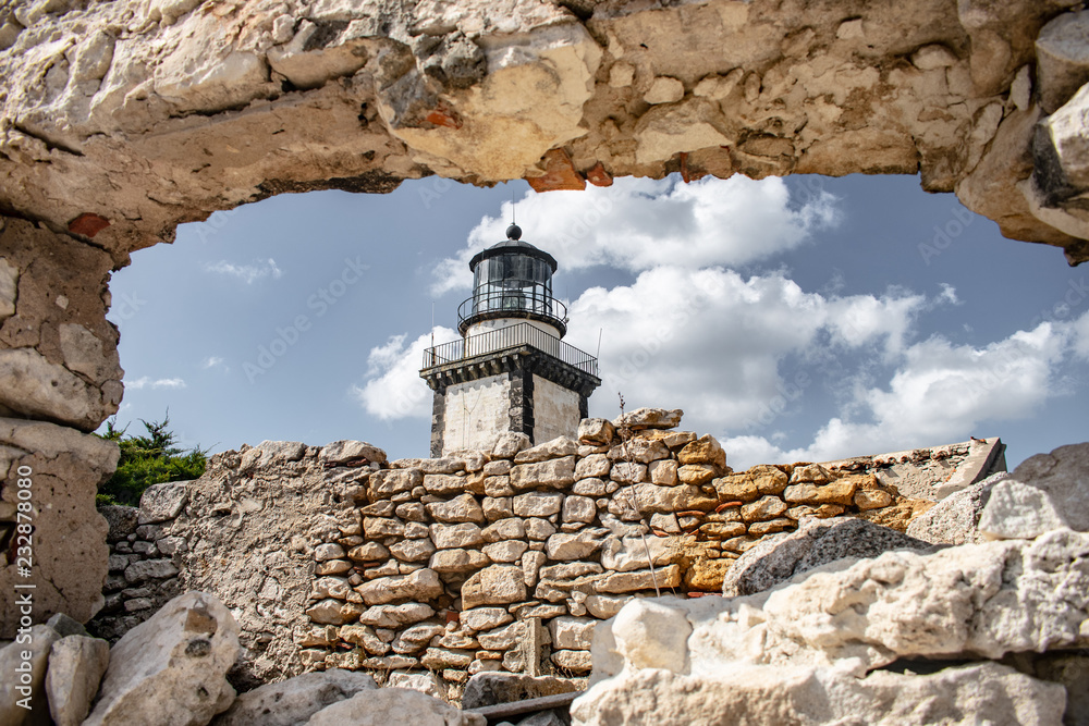 Old lighthouse trough hole in the wall Stock Photo | Adobe Stock