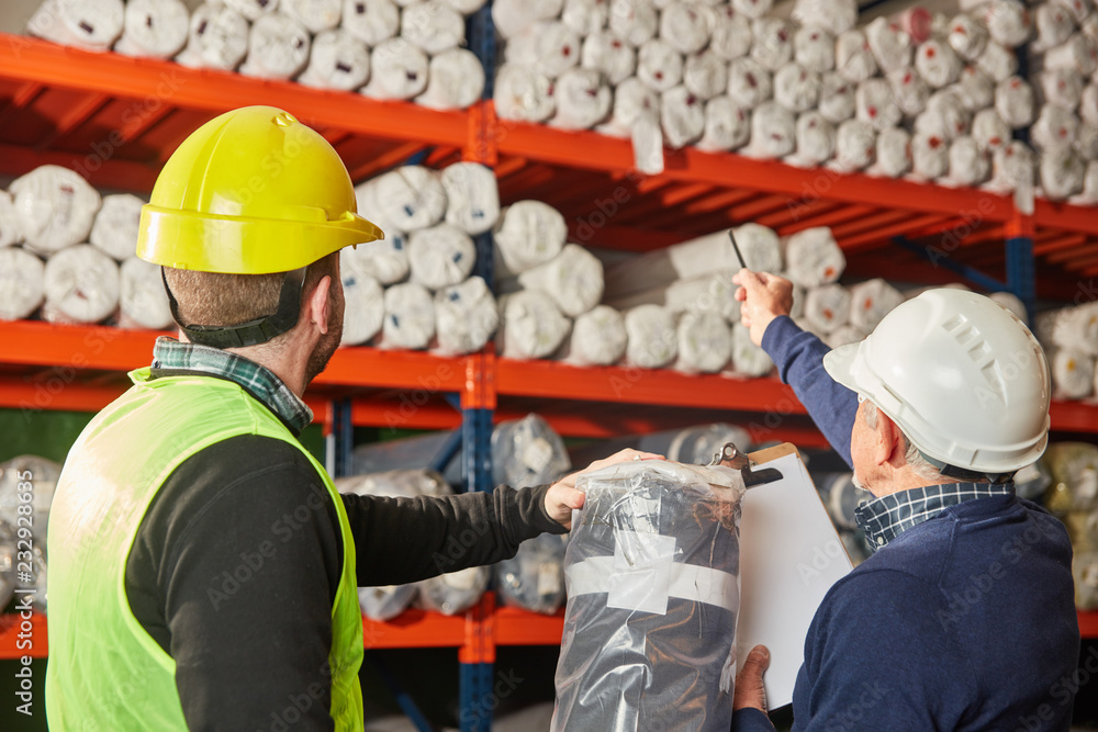 Zwei Lagerarbeiter im Teppichlager Stock Photo | Adobe Stock