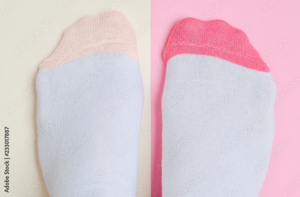 Women's feet with socks on a pastel colored background. Top view ...