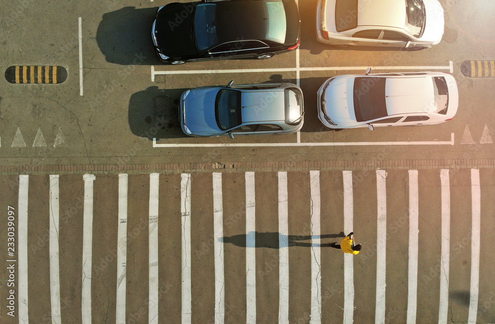 Parking lot with cars and pedestrian crossing Stock Photo | Adobe Stock