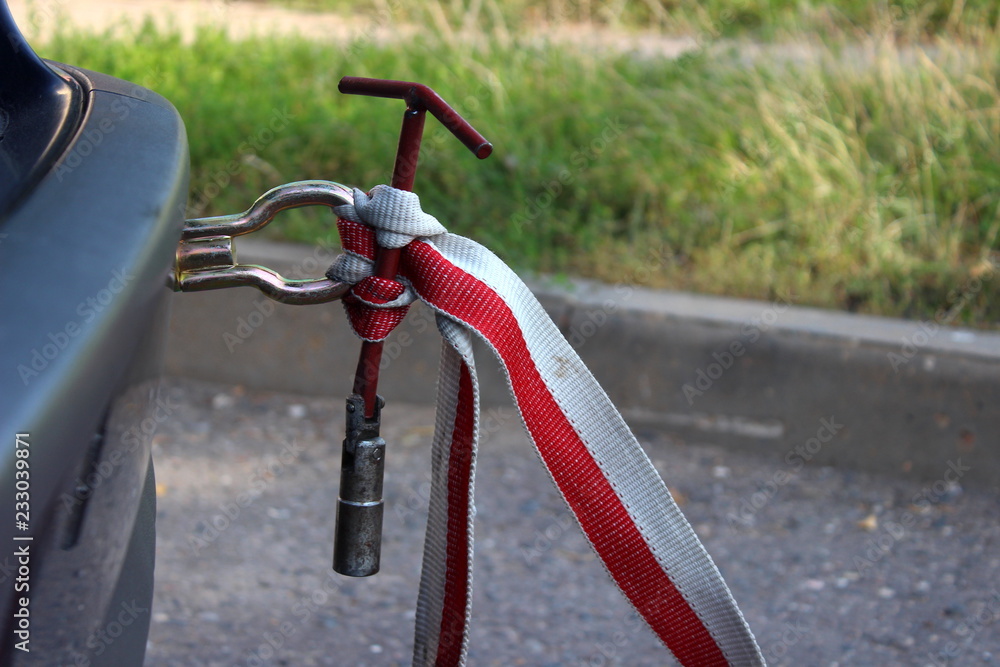 Technical assistance, car towing - red-white tow rope with candle key ...