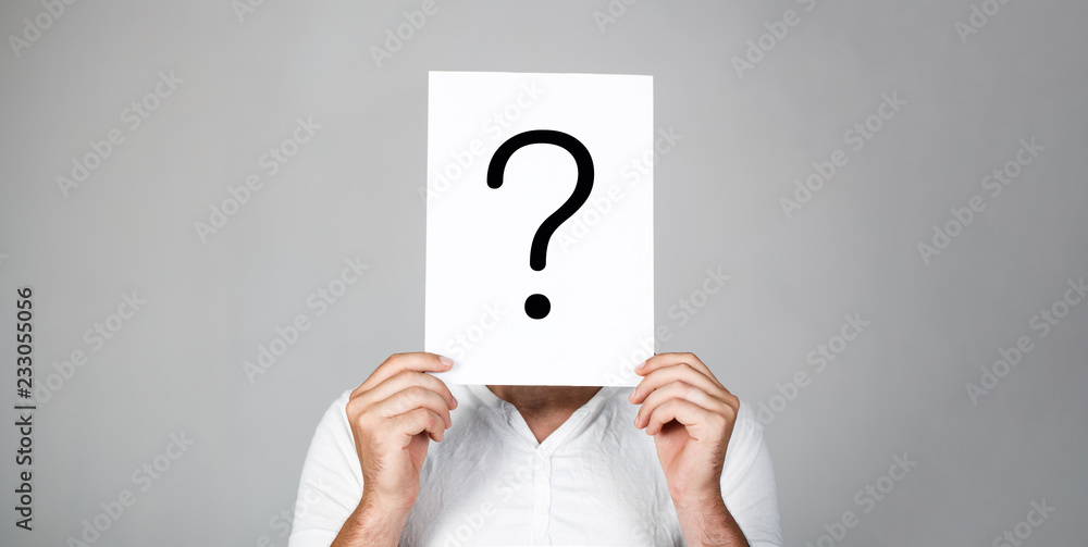 Man a question. Doubtful man holding Question Mark. Problems and ...