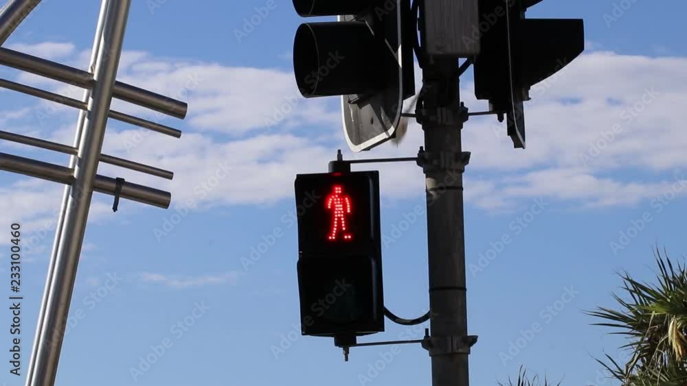 Traffic street light with walking man indicating when to stop and when ...